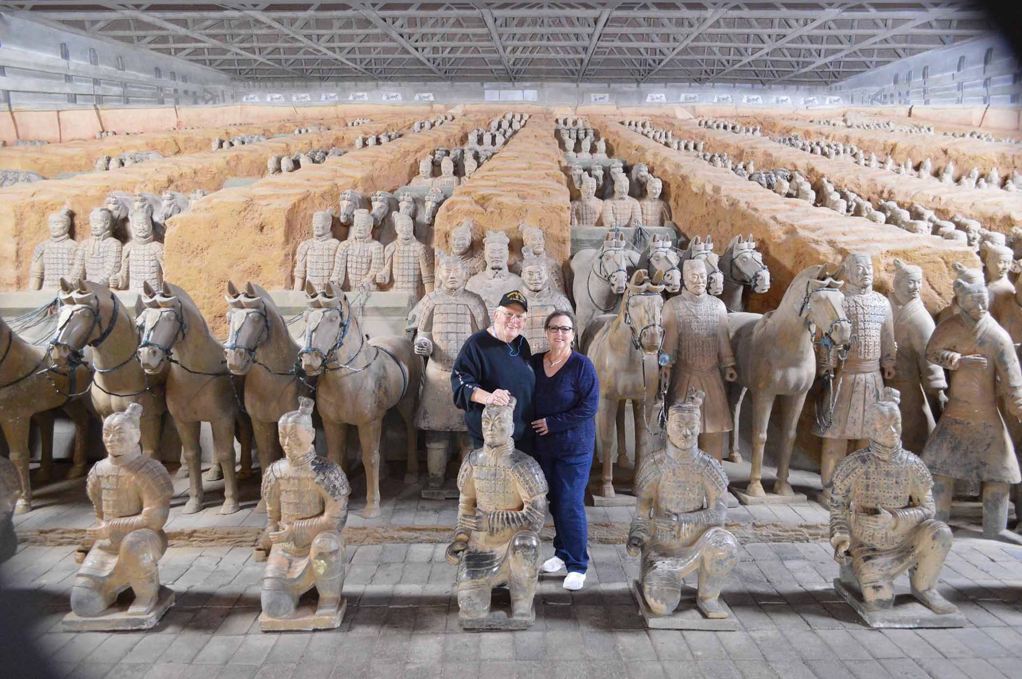 Carved soldiers & Bob & wife - TravelWorld International Magazine