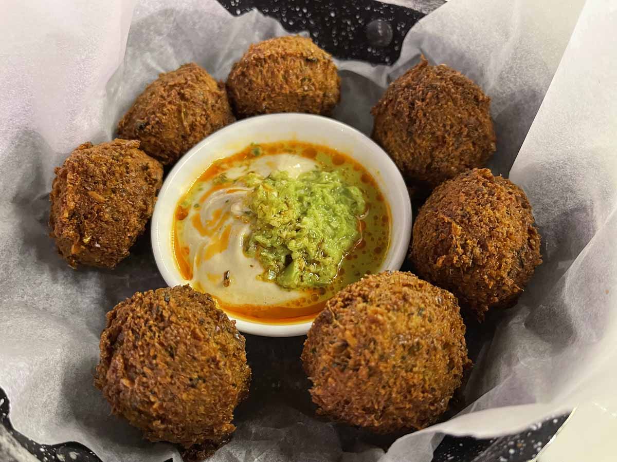 Israel-Falafel, tahini, and spicy pepper salsa at Mamilla's Happy Fish ...